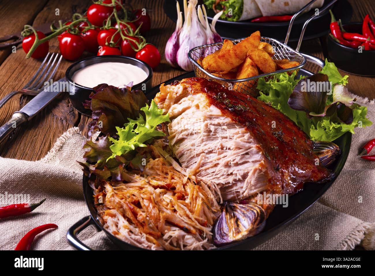 Delicious pulled pork with jacket potato quarters Stock Photo - Alamy