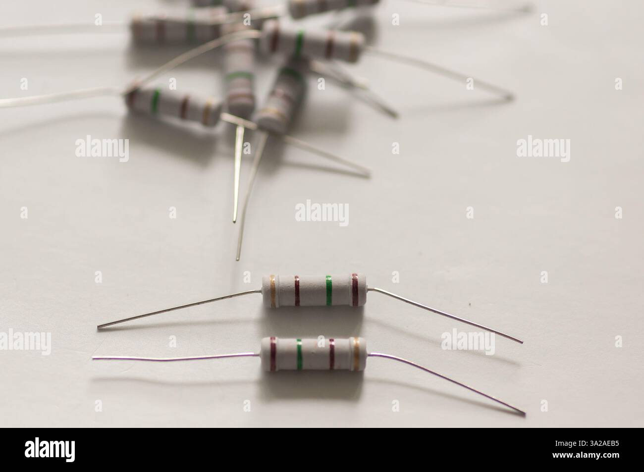 Close-up of color-coded resistors on a white background Stock Photo - Alamy