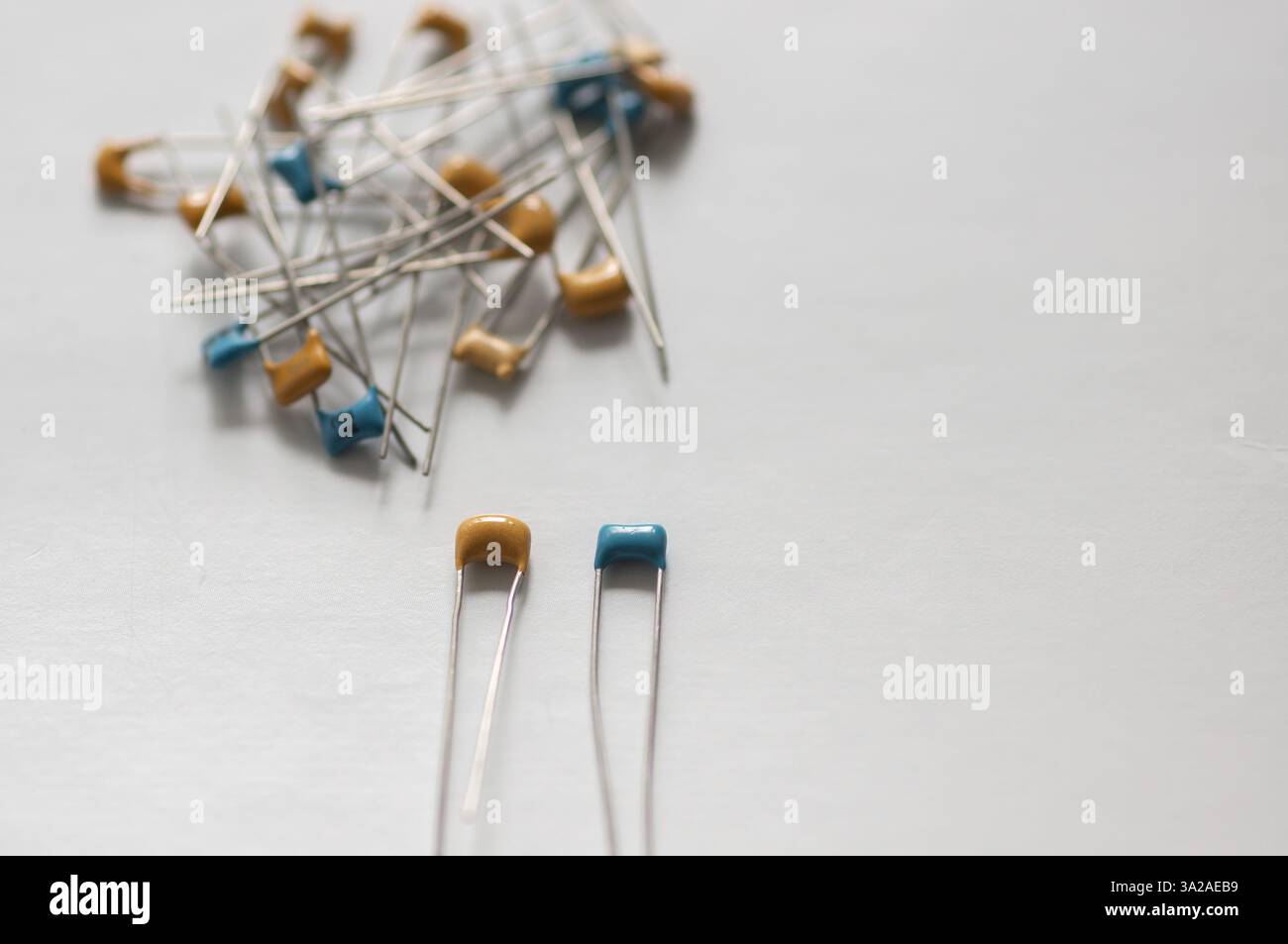 Ceramic capacitors with color markings close-up on a white background ...