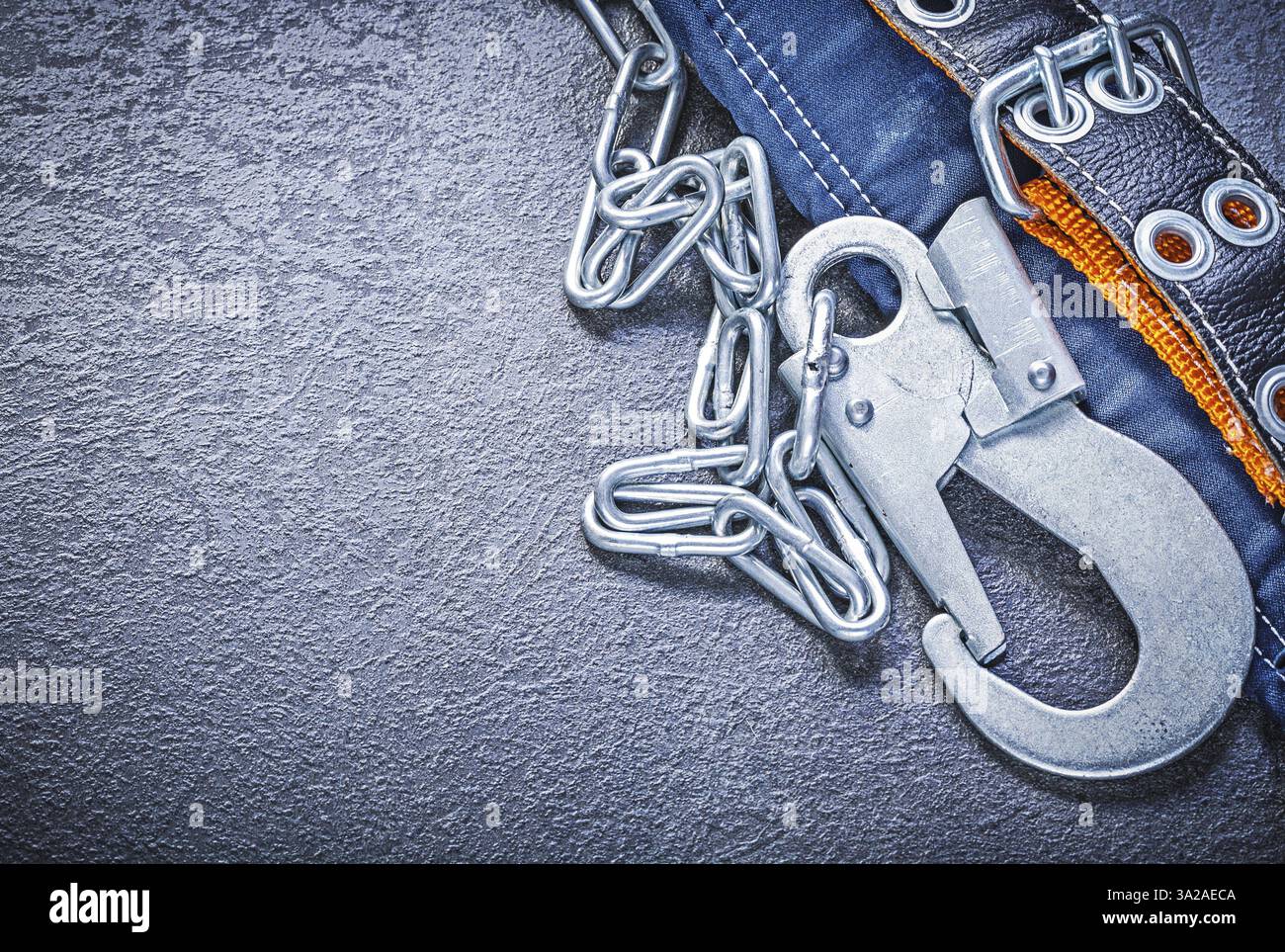 Safety strap with metal chain carabiners on black background directly ...
