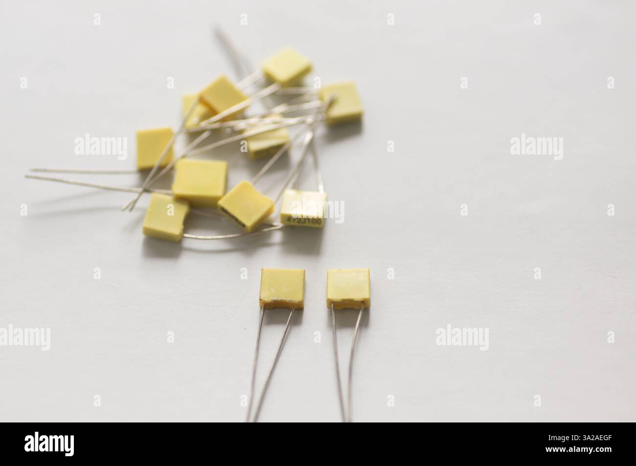 Ceramic capacitors with color markings close-up on a white background ...