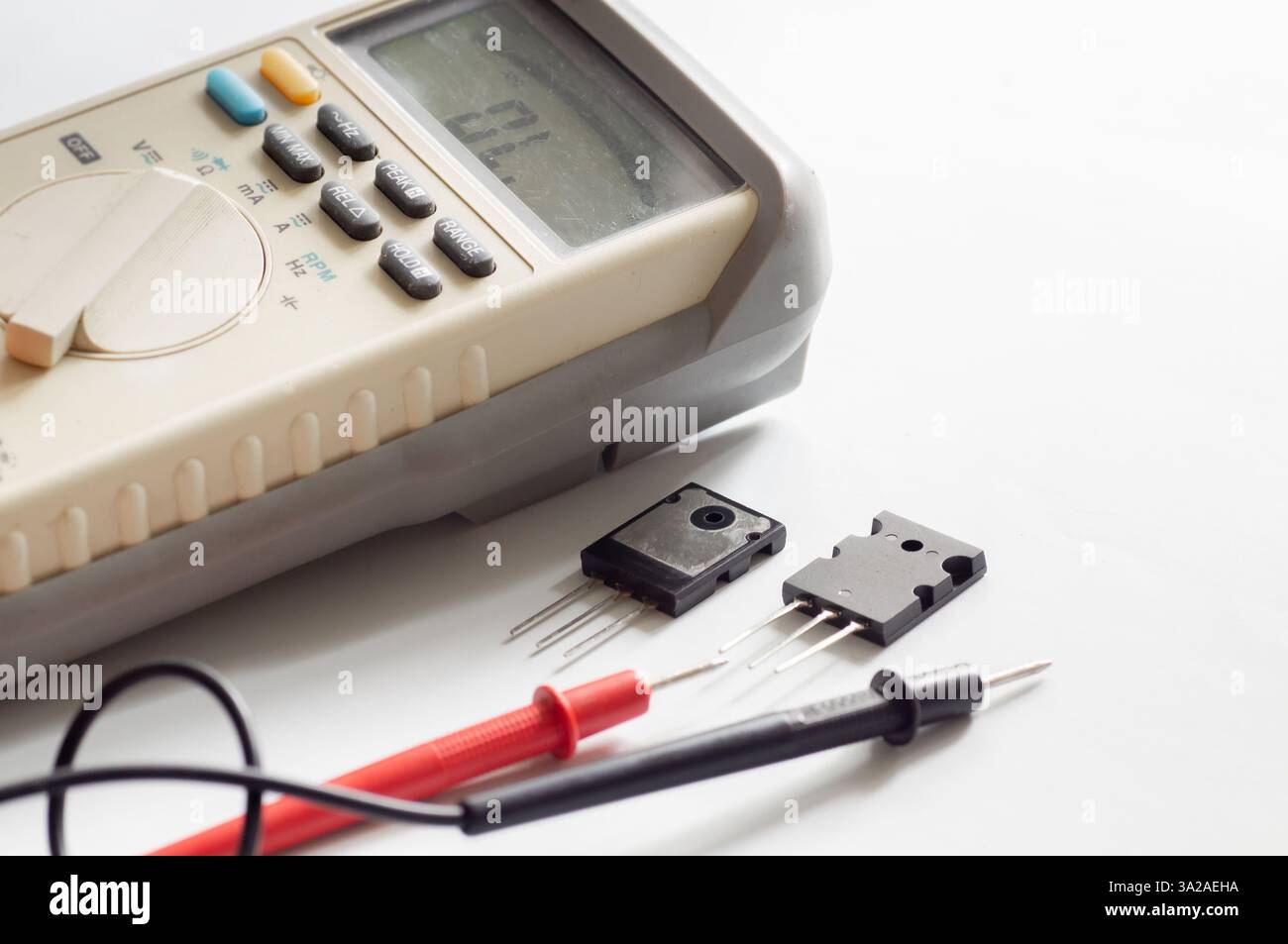 Multimeter probes and transistors Stock Photo - Alamy