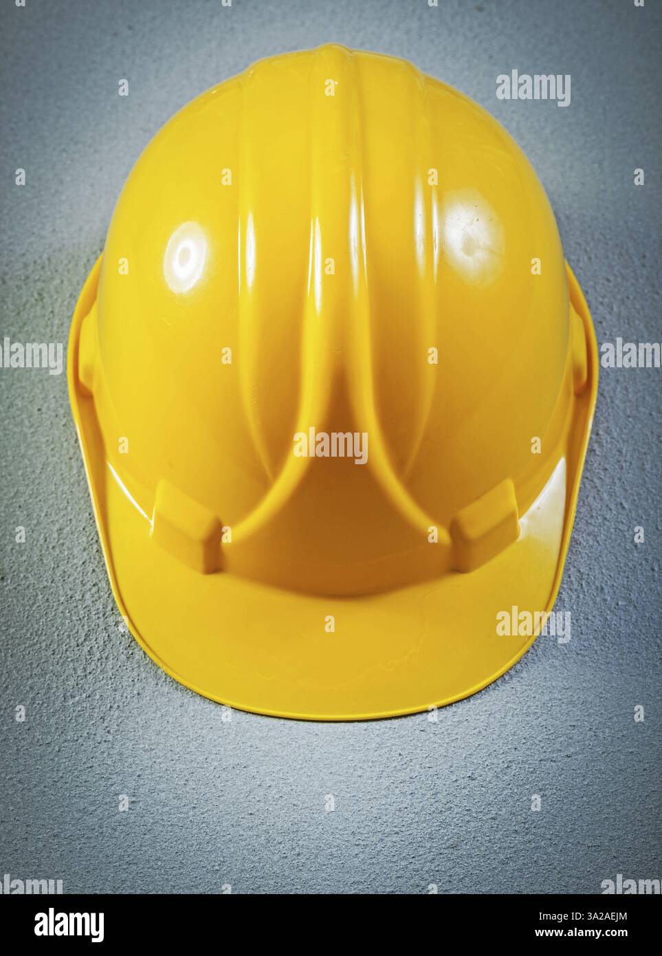 Safety building helmet on concrete background construction concept ...