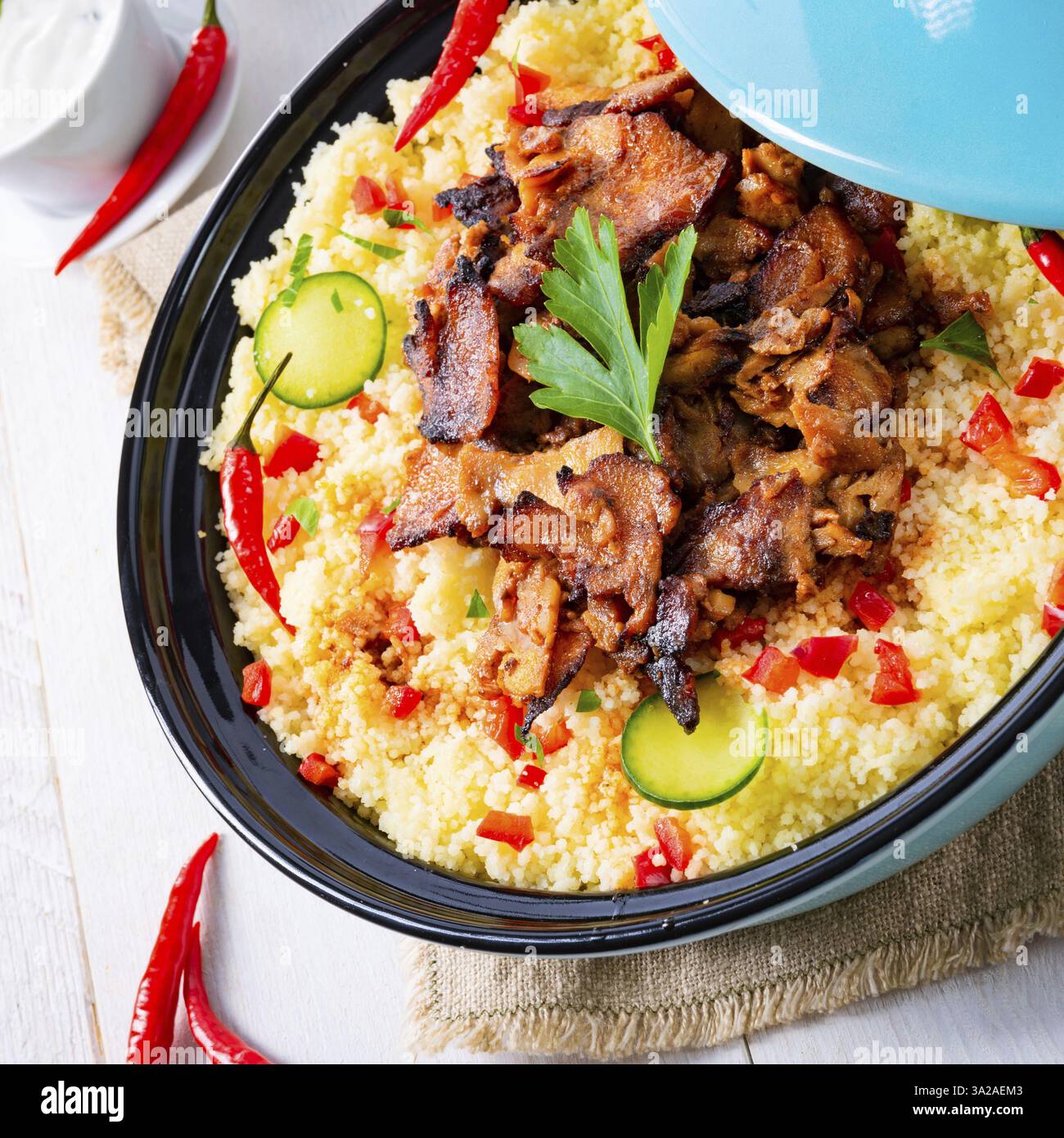 Tajin with couscous, vegetables and meat on a white background Stock ...