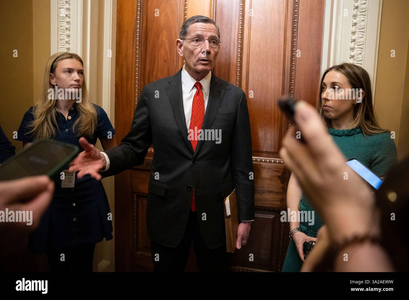 Sen. John Barrasso (R-Wyo.) speaks with reporters outside his office at ...