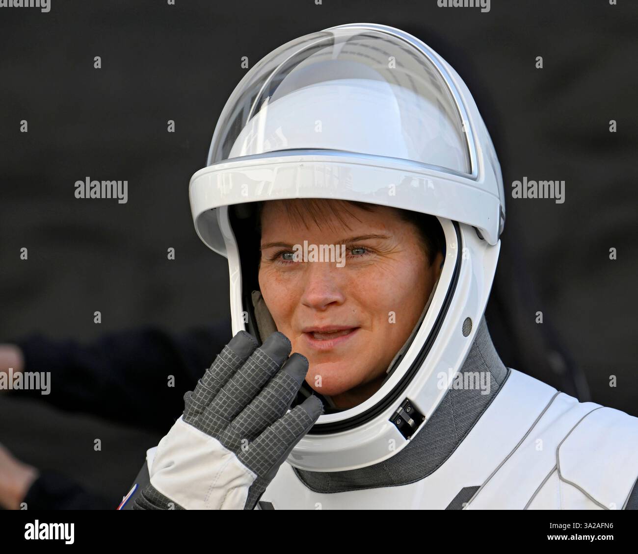 NASA Astronaut Anne McClain blows a kiss to her family after walking out of the Neil A Armstrong ...