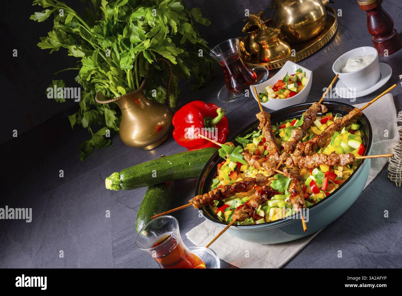 Lamb kebabs with curry rice and various vegetables Stock Photo - Alamy