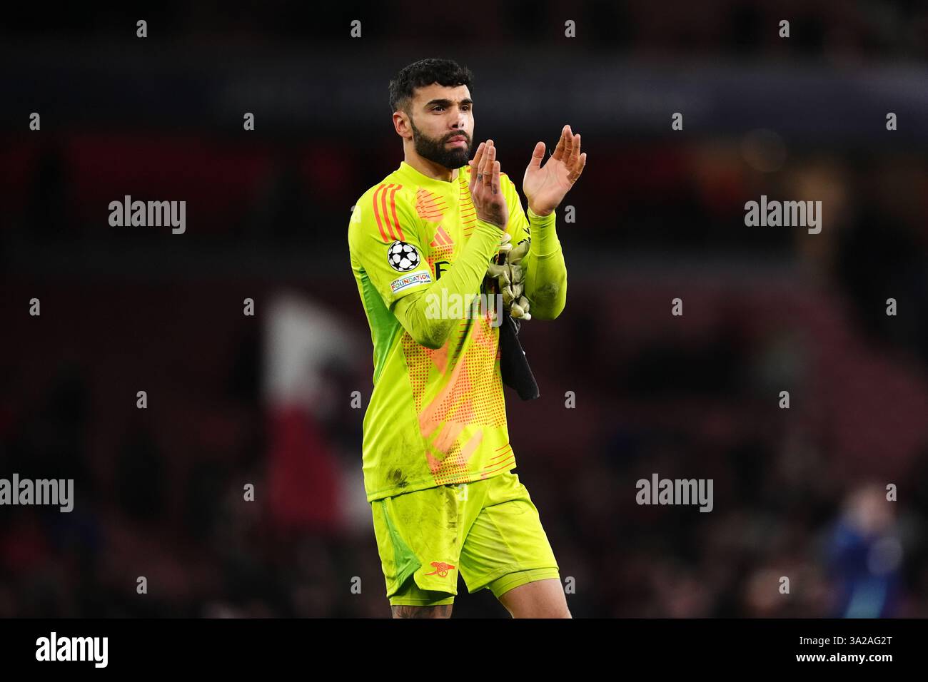 Arsenal goalkeeper David Raya applauds the fans following victory in ...