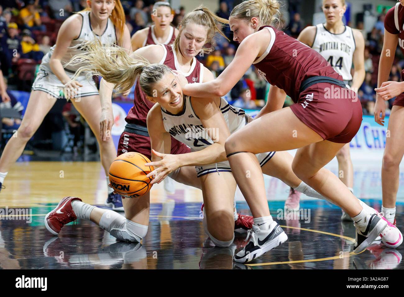 Montana State forward Lexi Deden (21) battles to get the ball out to a ...