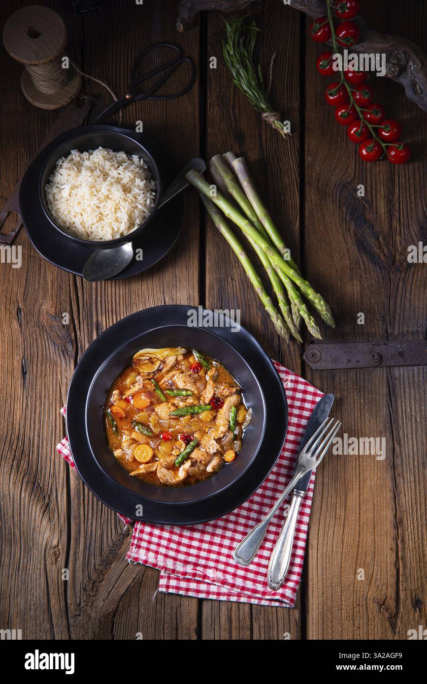 Colourful turkey fricassee with asparagus and peppers Stock Photo - Alamy