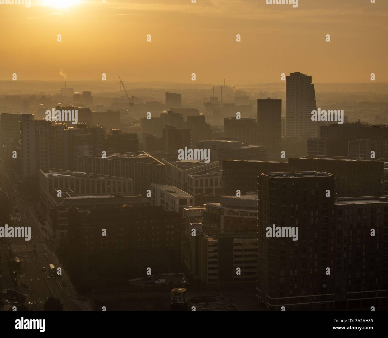 An aerial depiction of Leeds city at dawn, showcasing golden sunlight ...