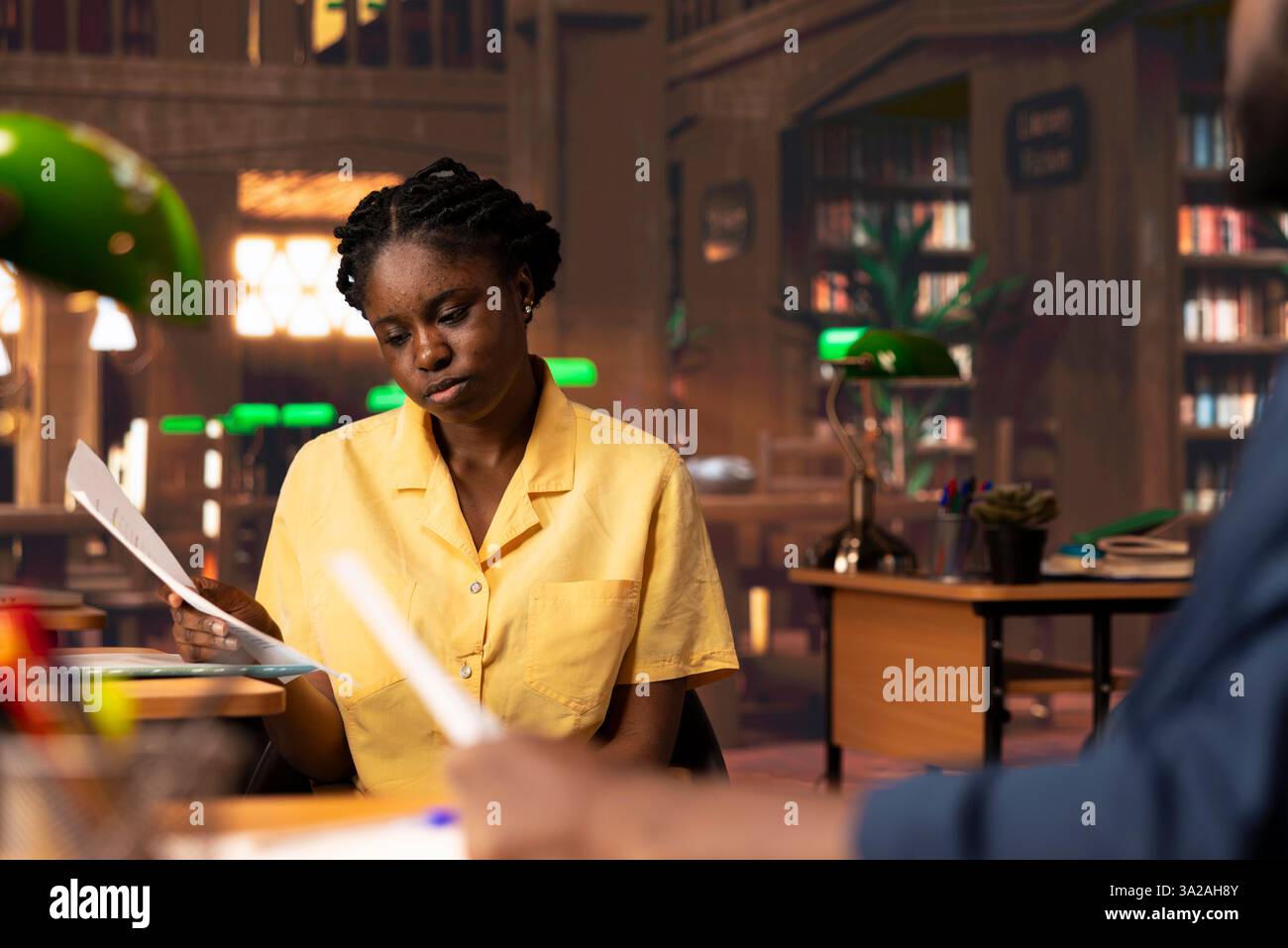 Students team read through an academic project in a vintage library ...