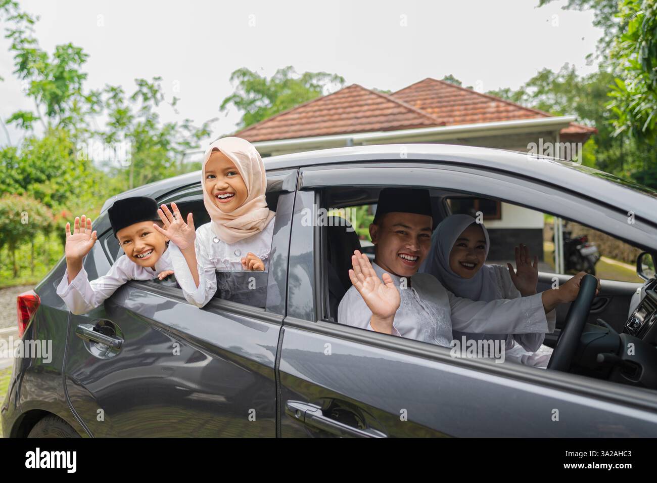 An Indonesian Muslim family is going mudik or traveling to their ...