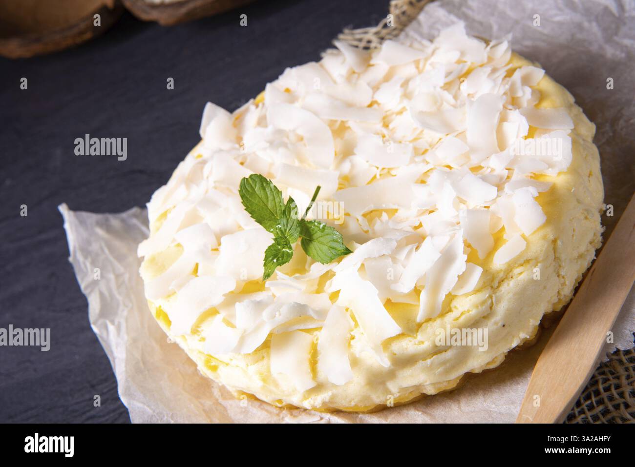 A simple quark coconut cake from the tin Stock Photo - Alamy