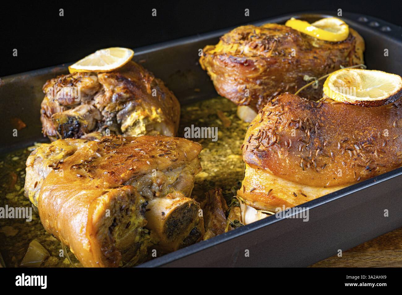 Crispy roasted pork bones from the oven Stock Photo - Alamy