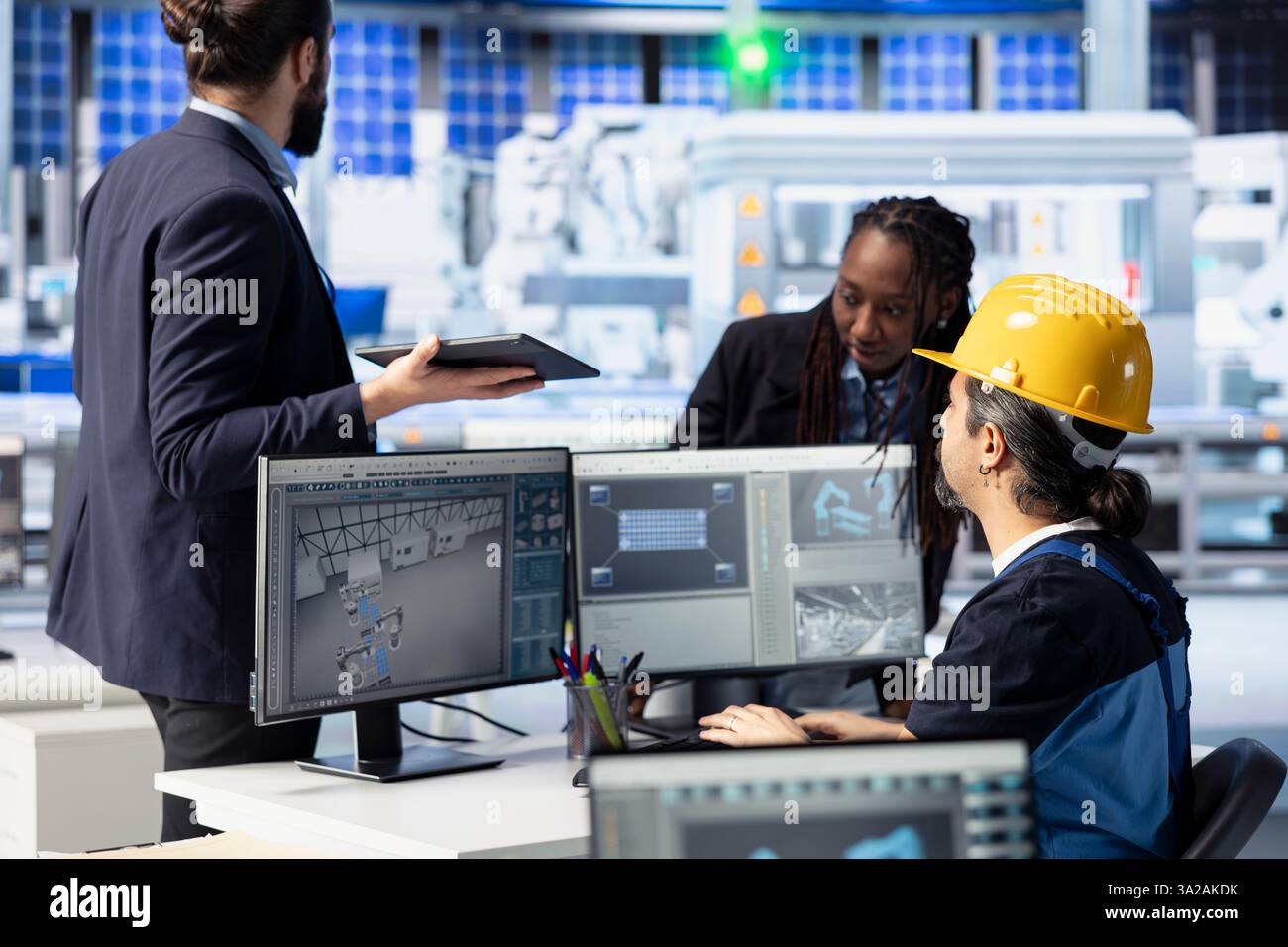 Photovoltaics factory engineering team doing brainstorming, reviewing system logs to identify ...