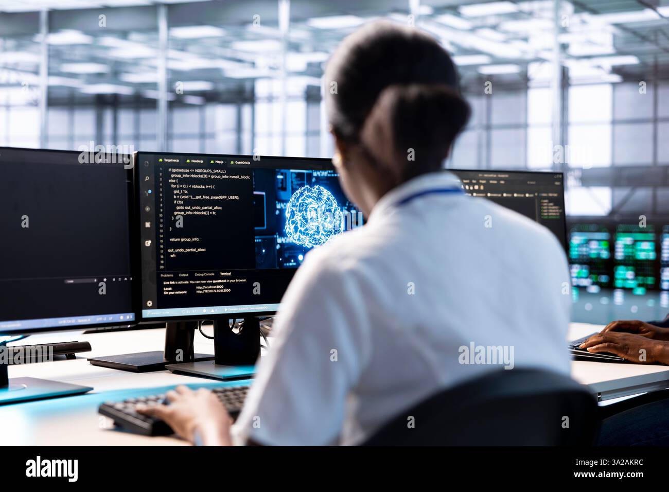 Server hub IT expert using AI systems to input data faster during complex computational tasks ...