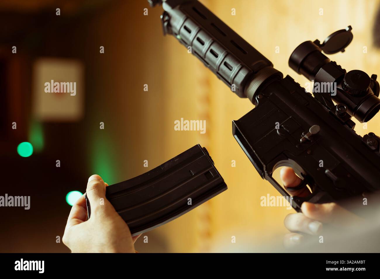 Close up of firing range client reloading rifle, enjoying fun indoor ...