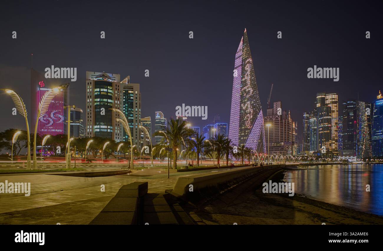 Doha Qatar skyline from corniche promenade at night in the West Bay ...