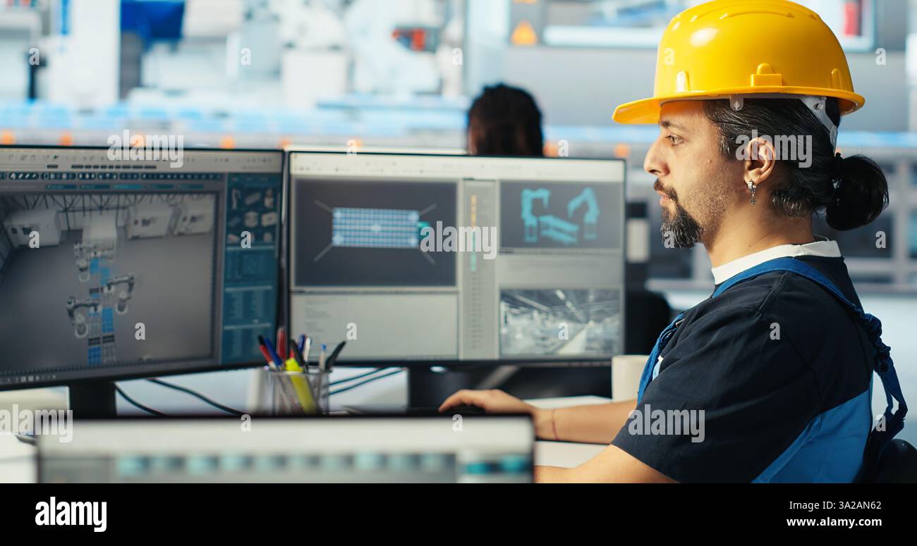 Photovoltaics factory engineer using CAD software, planning work on ...