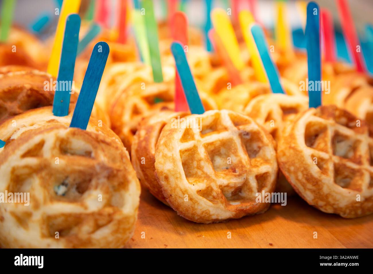 A view of several bite-sized waffles on popsicle sticks Stock Photo - Alamy
