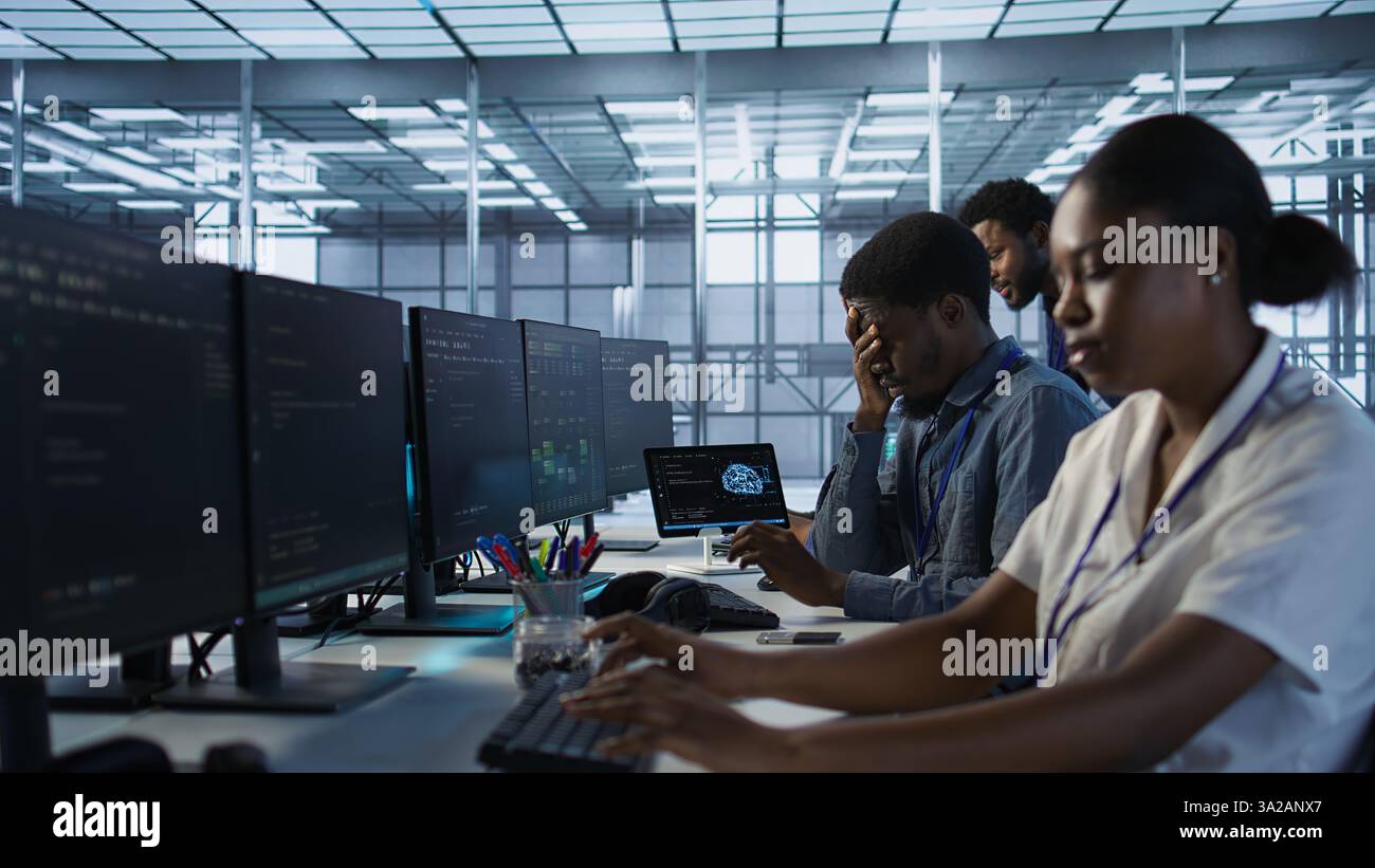 Tired data center engineer yawning hi-res stock photography and images ...