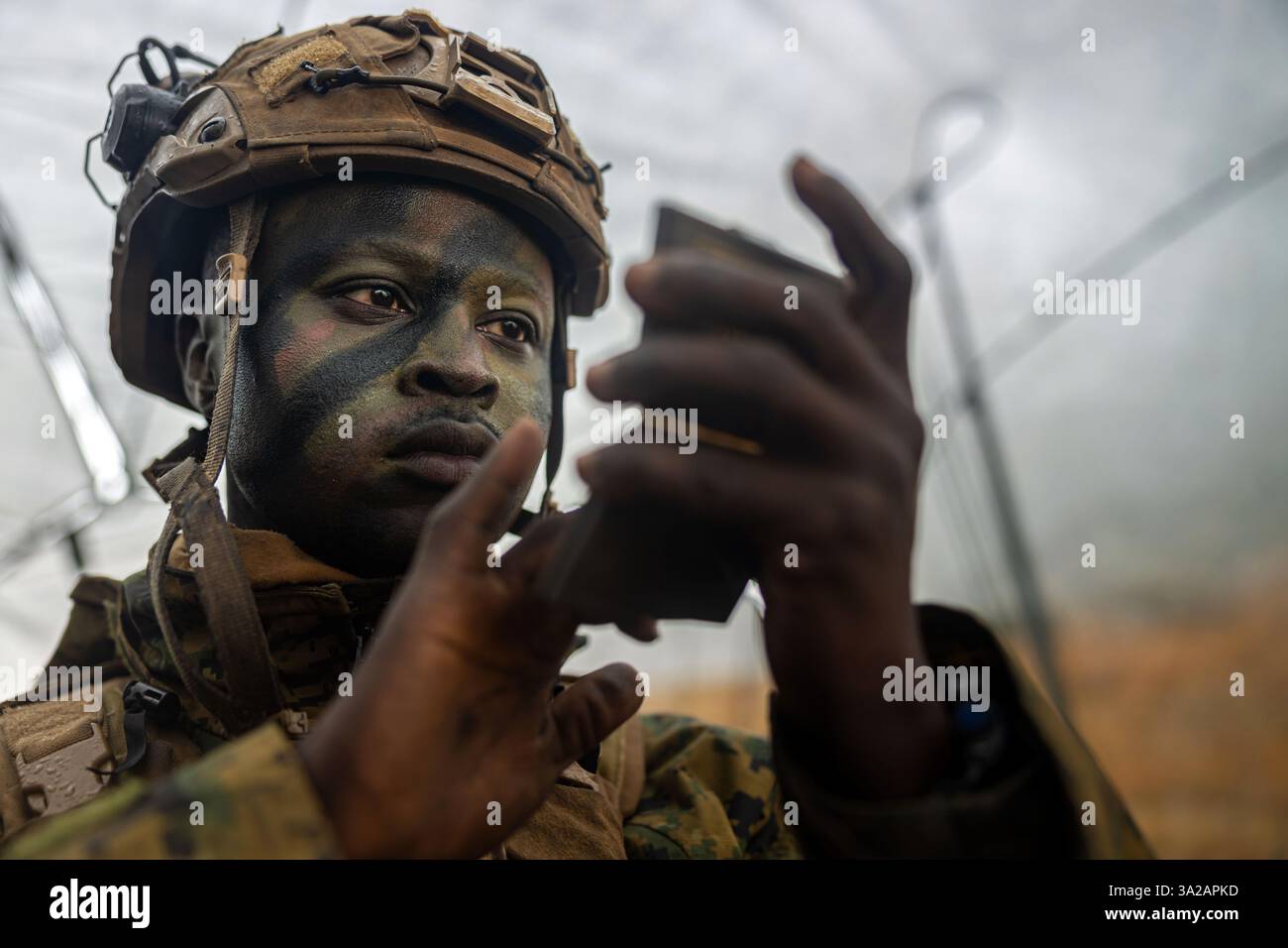 March 1, 2025 - Oita, Japan - U.S. Marine Corps Sgt. Bior Gar applies ...