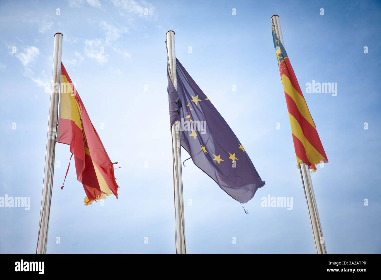 Three flags—Spain, the European Union, and Comunidad Valenciana—flutter ...