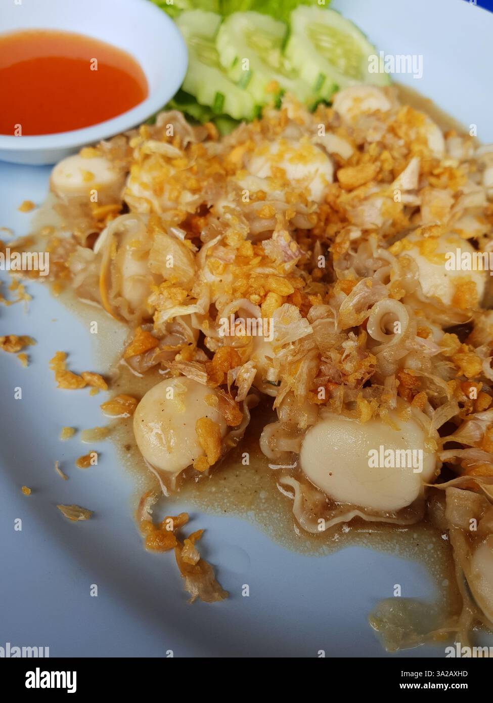 Garlic fried scallop ligament pen shell for sale at Thai street food ...