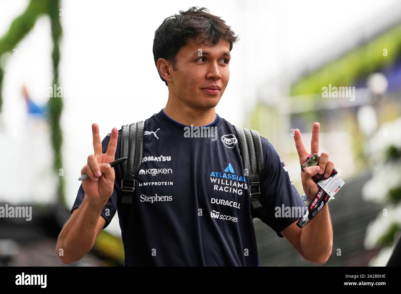 Williams driver Alexander Albon of Thailand gestures as he arrives at ...