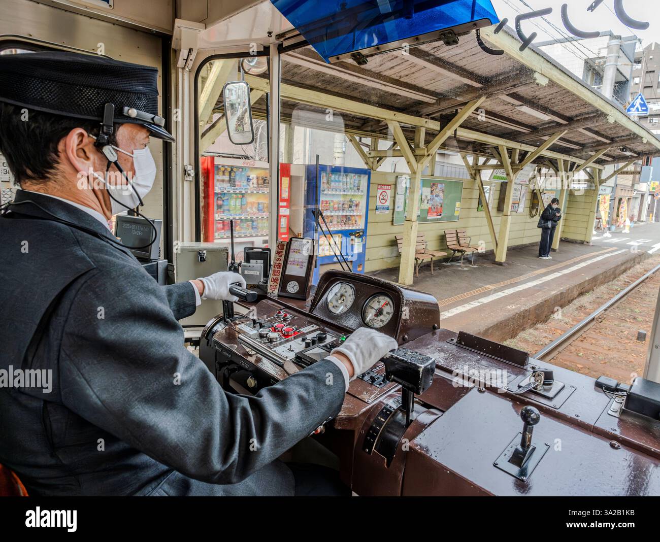 A view of the driver and cab on a Hankai Tramway 601 Series car at ...