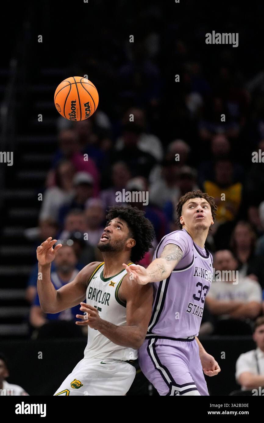 Baylor's Norchad Omier and Kansas State's Coleman Hawkins (33) reach ...