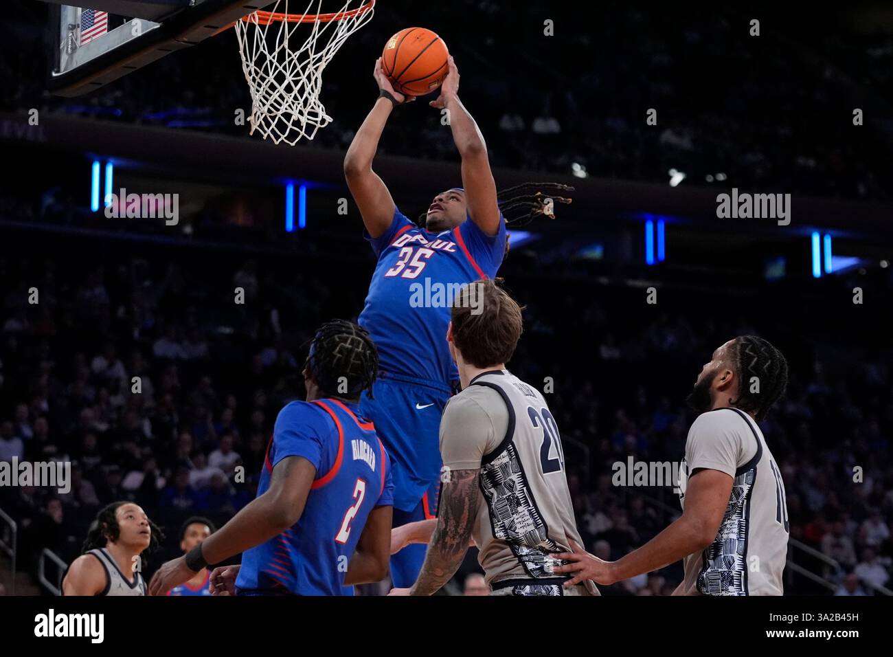 DePaul's NJ Benson (35) shoots over Georgetown's Drew Fielder (20 ...
