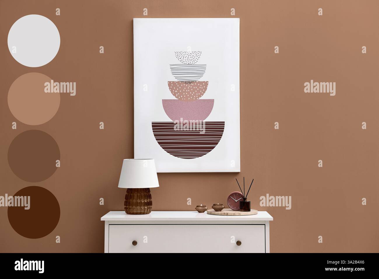 Console table with lamp, candles, clock and reed diffuser near wall in ...