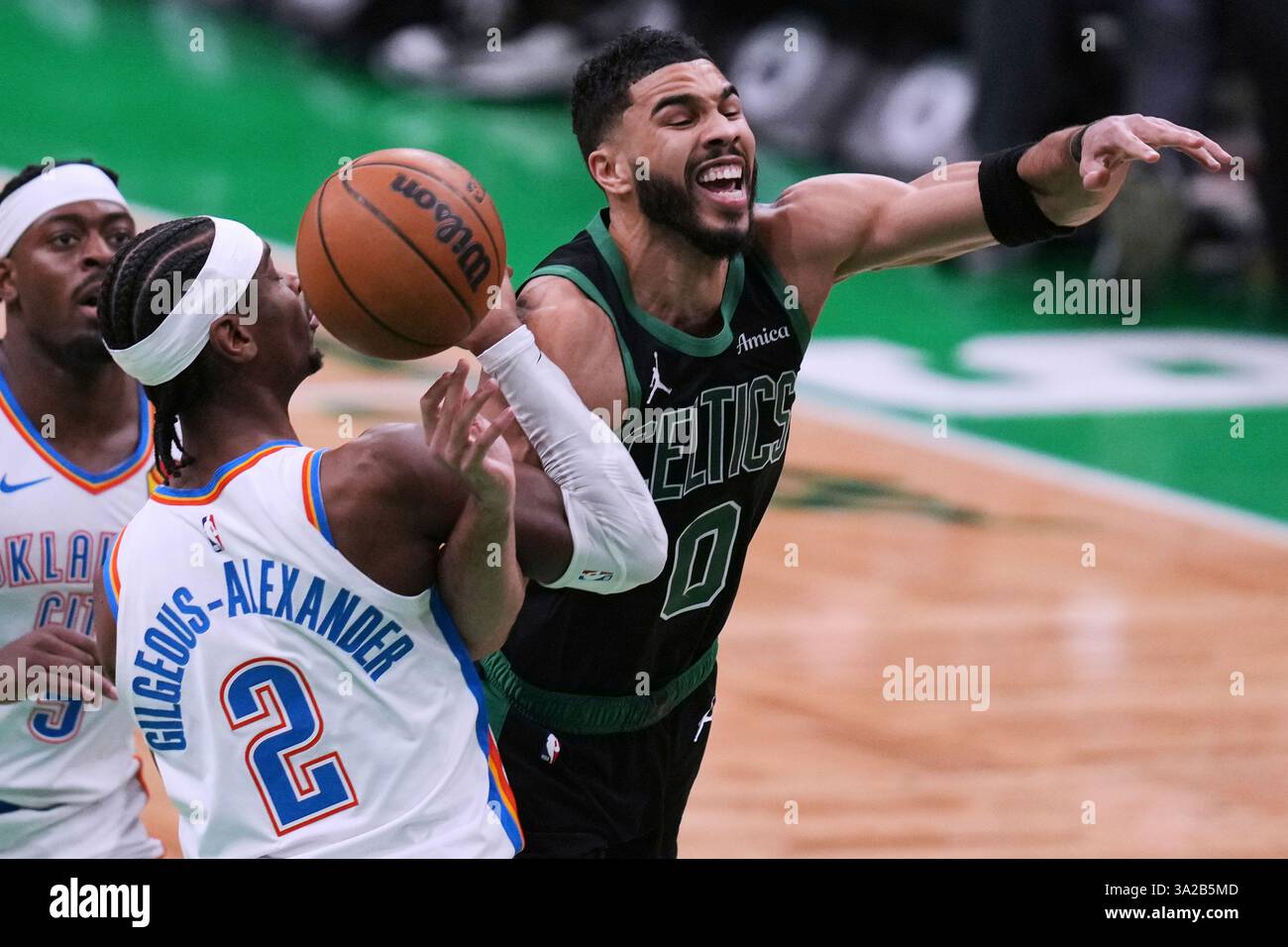 Boston Celtics forward Jayson Tatum (0) is fouled by Oklahoma City ...
