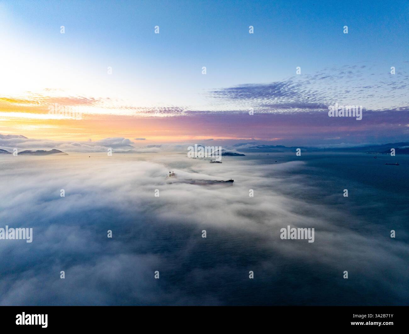A Bergebulk container ship fights its way through the fog. Sea fog ...