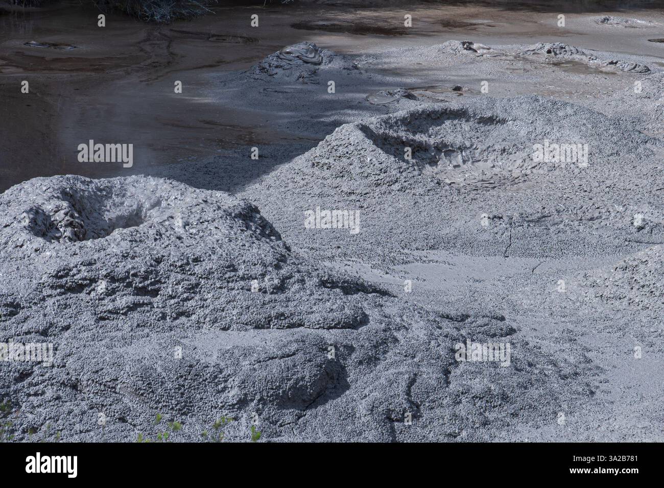 Bubbling thermal mud forms small, smoking volcanic-like structures ...