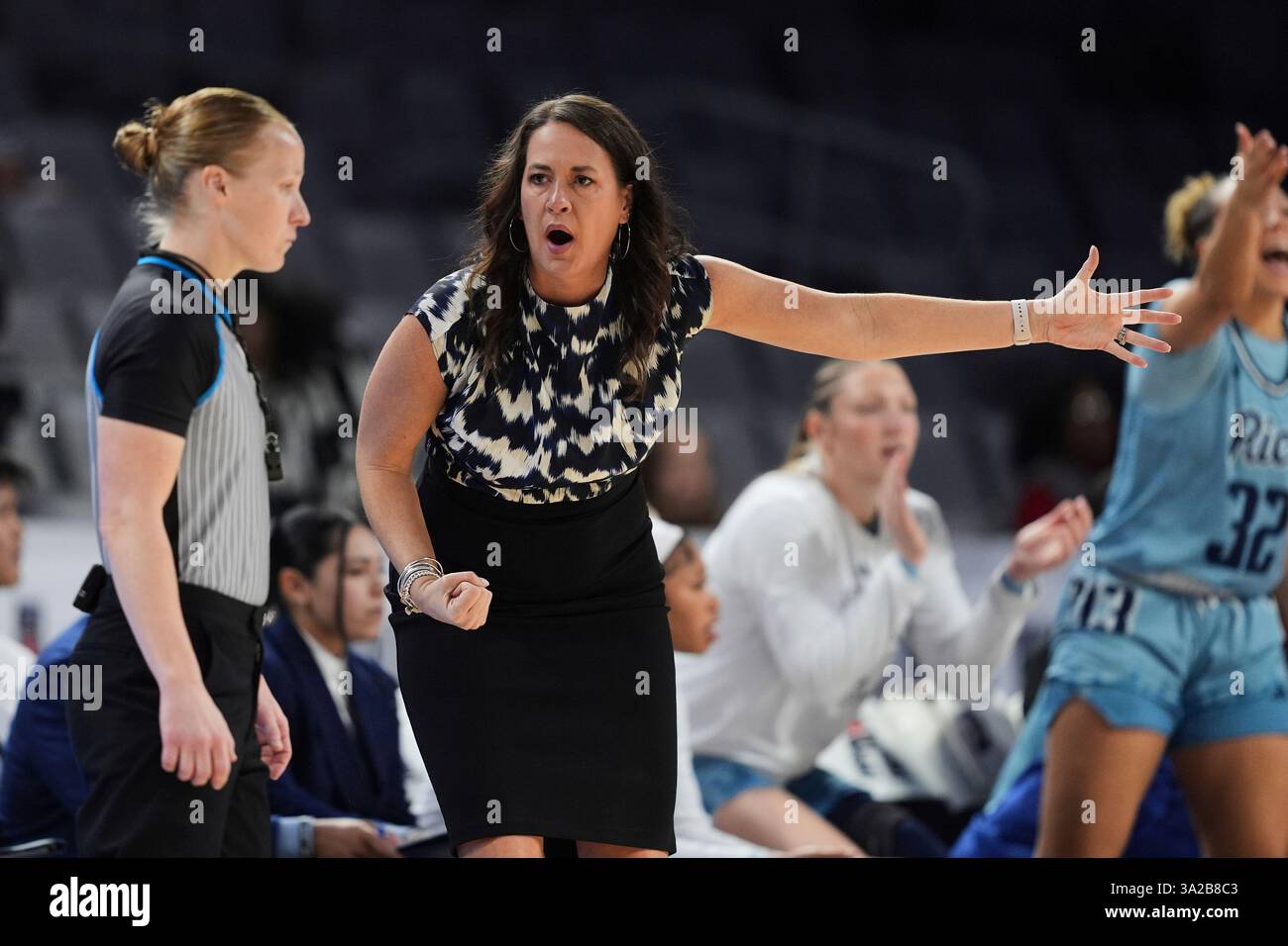 Rice head coach Lindsay Edmonds shouts an official as her team plays ...