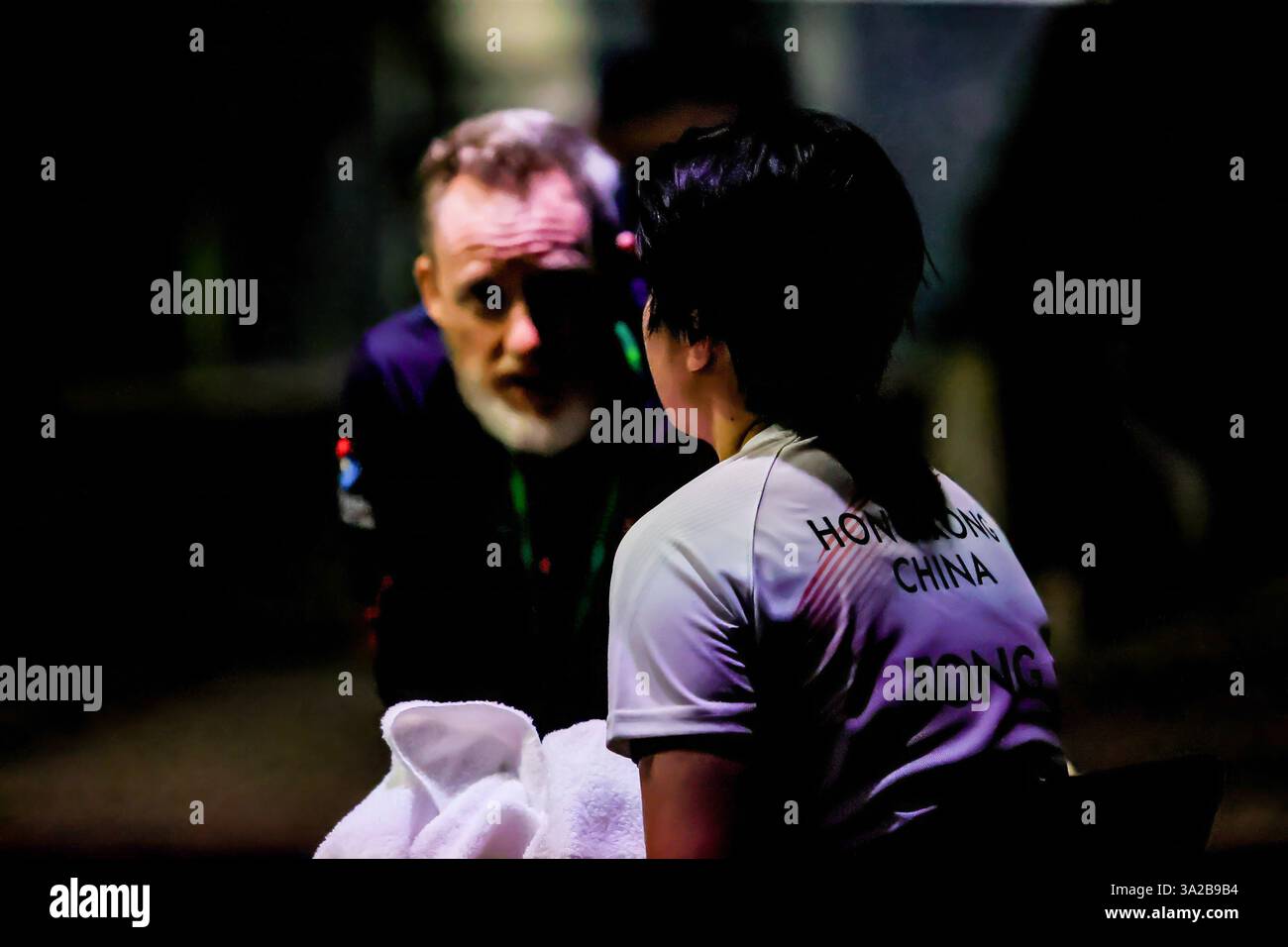 Hong Kong’s Tong Tsz Wing talking to her coach mid-match. It was a ...