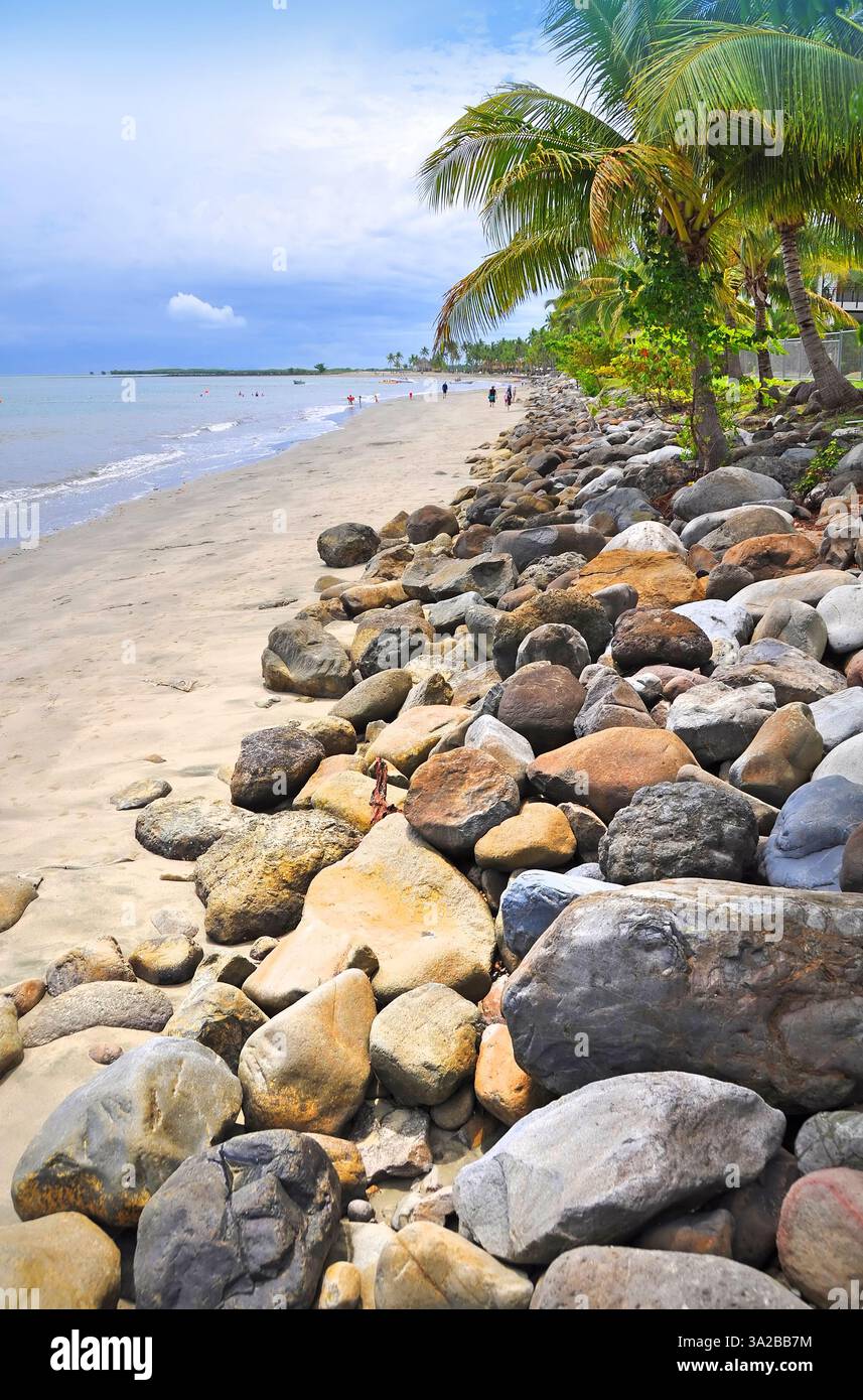 Fiji's Denarau island beach and rocky shoreline with palms Stock Photo ...