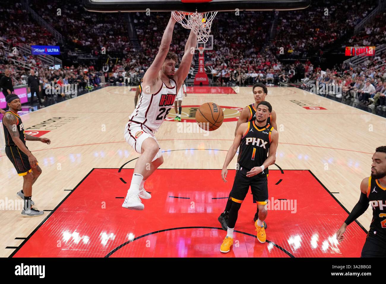 Houston Rockets' Alperen Sengun (28) dunks the ball as Phoenix Suns ...