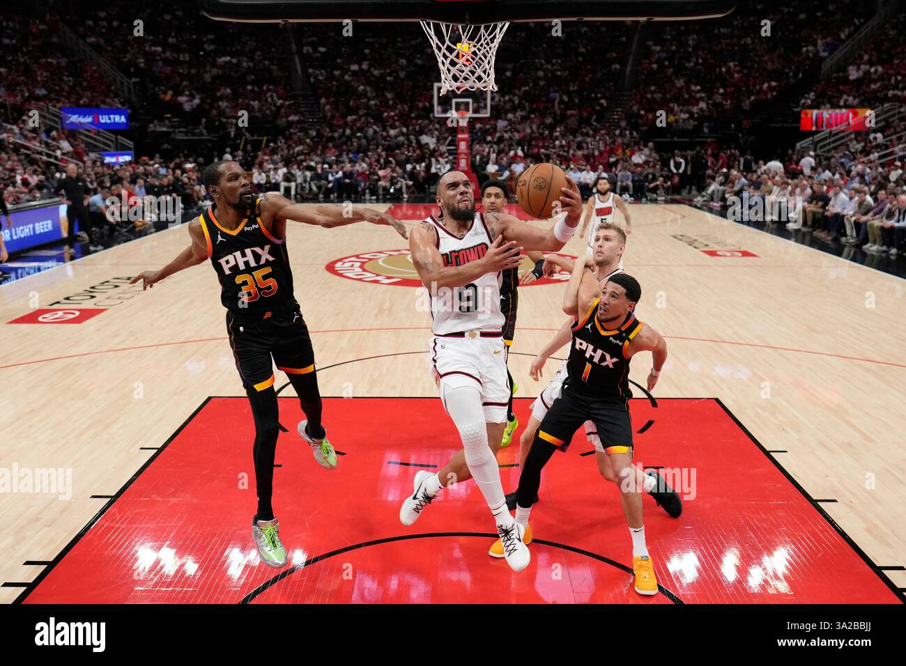Houston Rockets' Dillon Brooks (9) goes up for a shot as Phoenix Suns ...