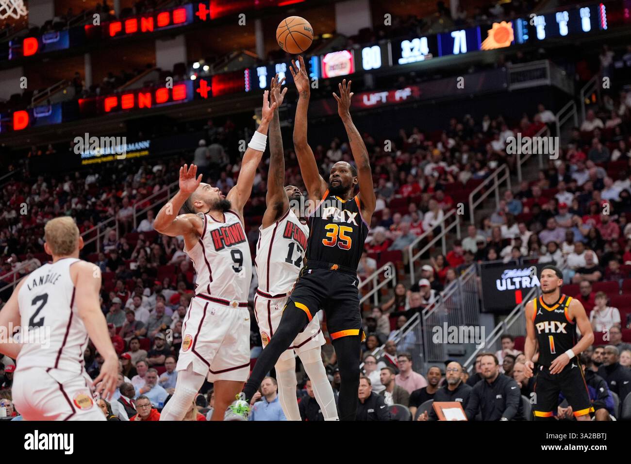 Phoenix Suns' Kevin Durant (35) shoots as Houston Rockets' Dillon ...