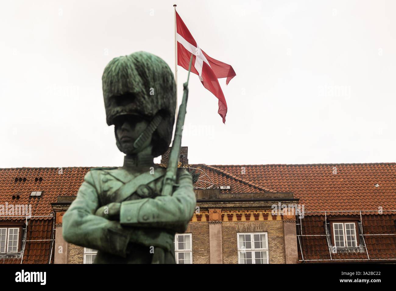 Statue of a Royal Life Guard in front of the†Danish flag at Rosenborg ...