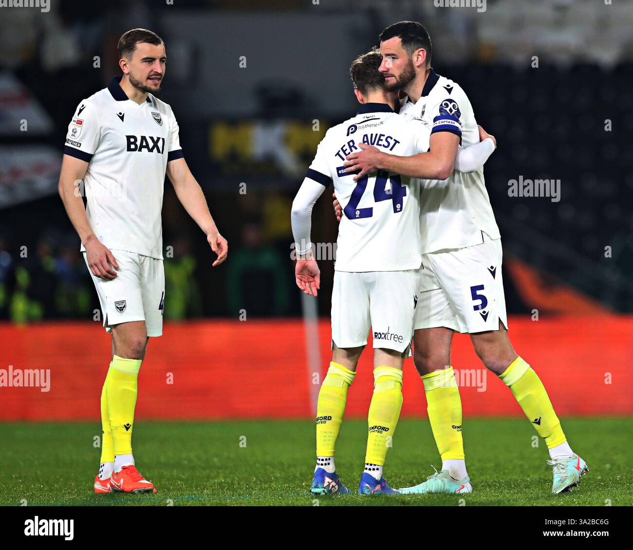 Hull, UK. 12th Mar, 2025. Hidde ter Avest of Oxford United and Elliott ...