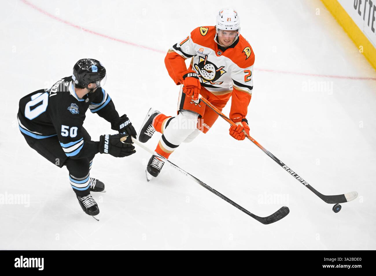 Anaheim Ducks center Isac Lundestrom (21) skates past Utah Hockey Club ...