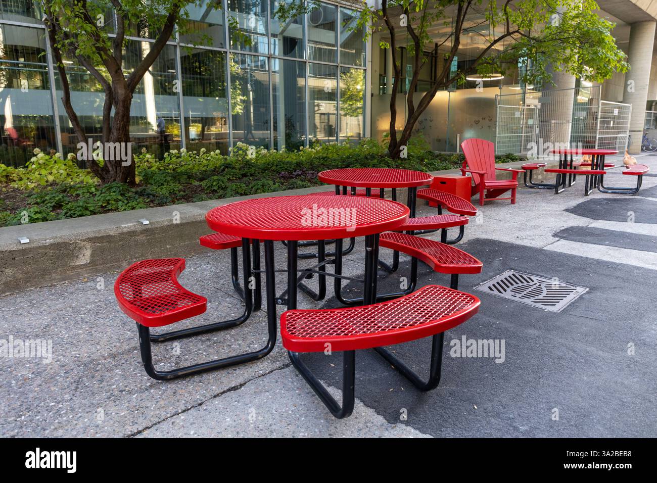 Red outdoor table with benches near office building in Sparks street in ...