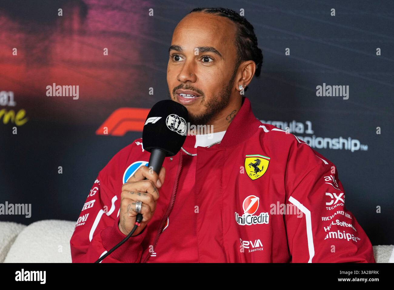 Ferrari driver Lewis Hamilton of Britain answers questions during a ...