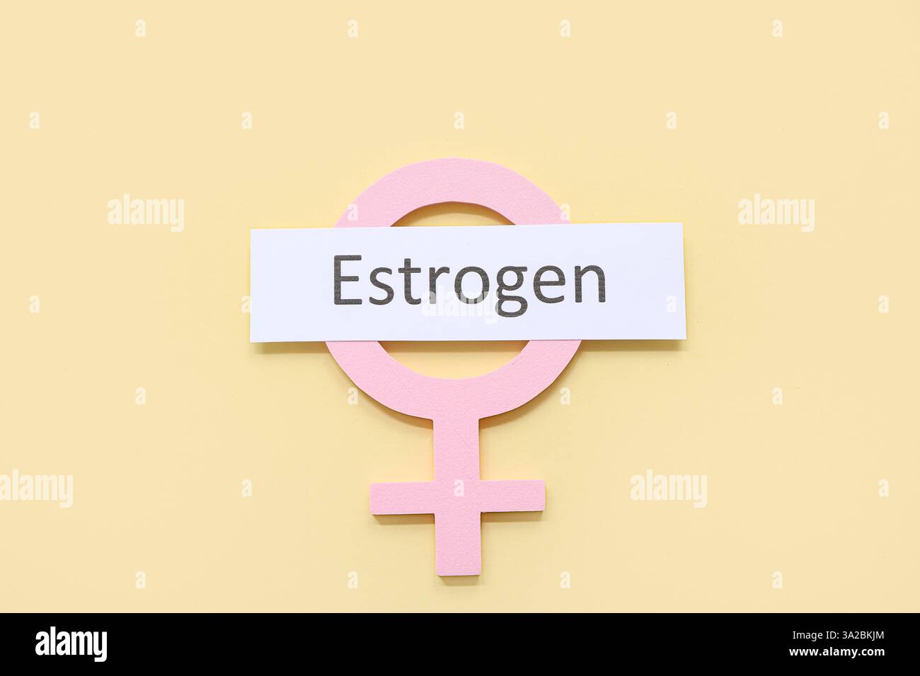 Word ESTROGEN with paper symbol of woman on beige background Stock ...