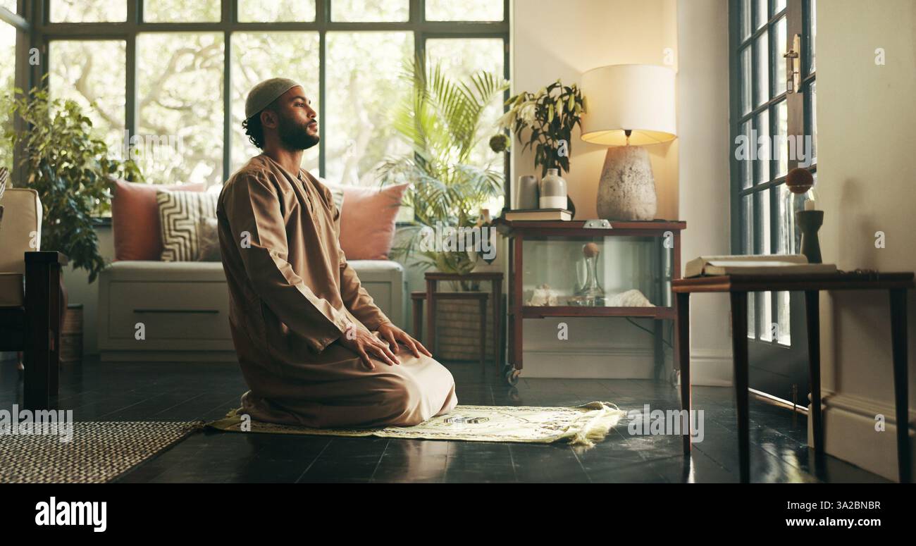 Muslim, man and praying with faith at house for spiritual worship ...